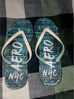 Shoes | Y2k Aero Nyc Flip Flops With Blue And Black Tribal Pattern ...